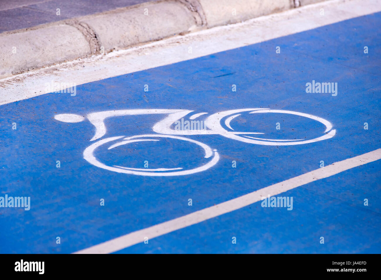 Marking on the bike lane and traffic signs Stock Photo - Alamy