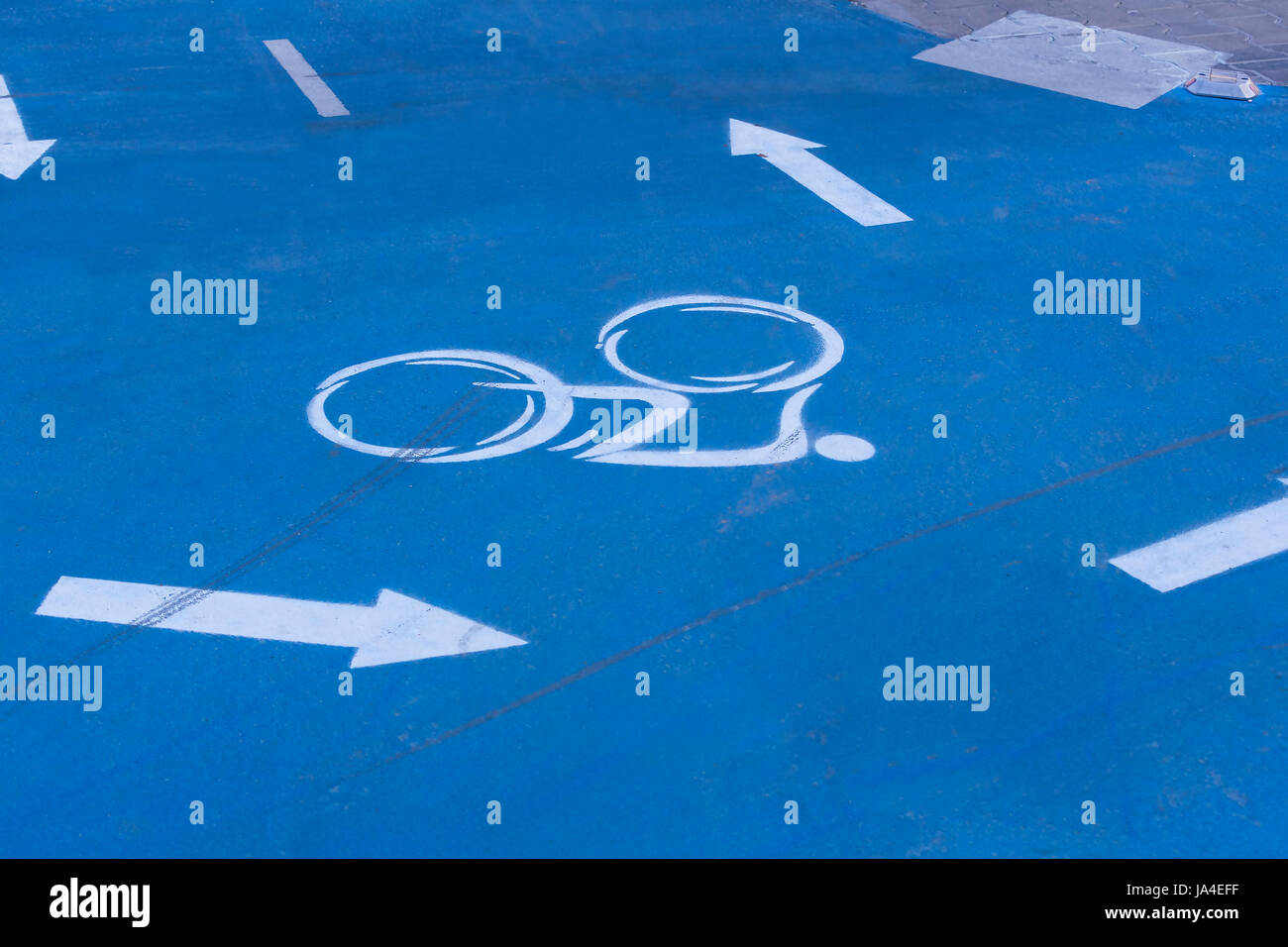 Marking on the bike lane and traffic signs Stock Photo - Alamy