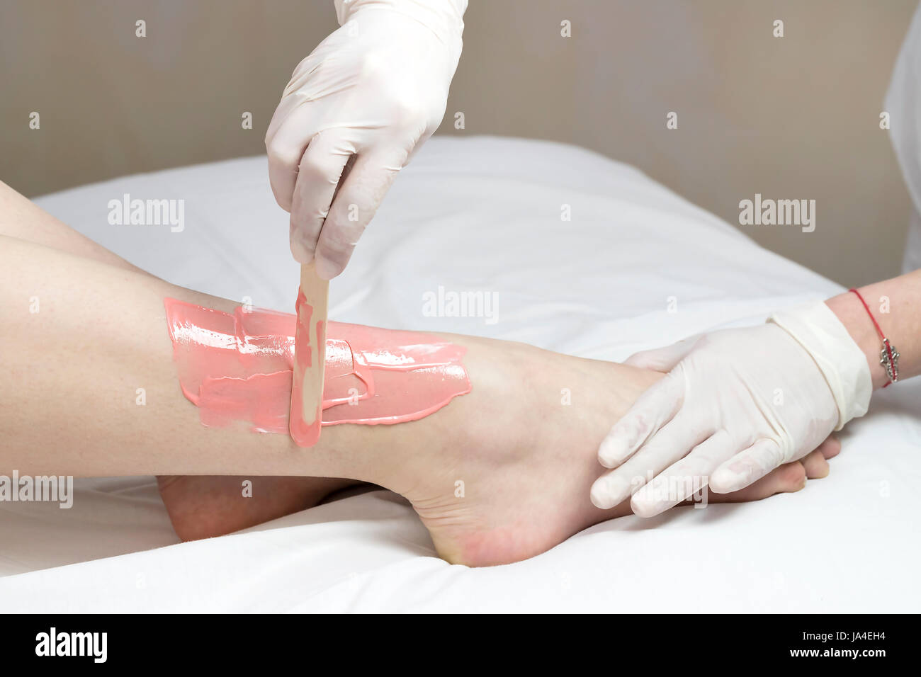 Process depilation female legs and hands in a beauty salon Stock Photo ...