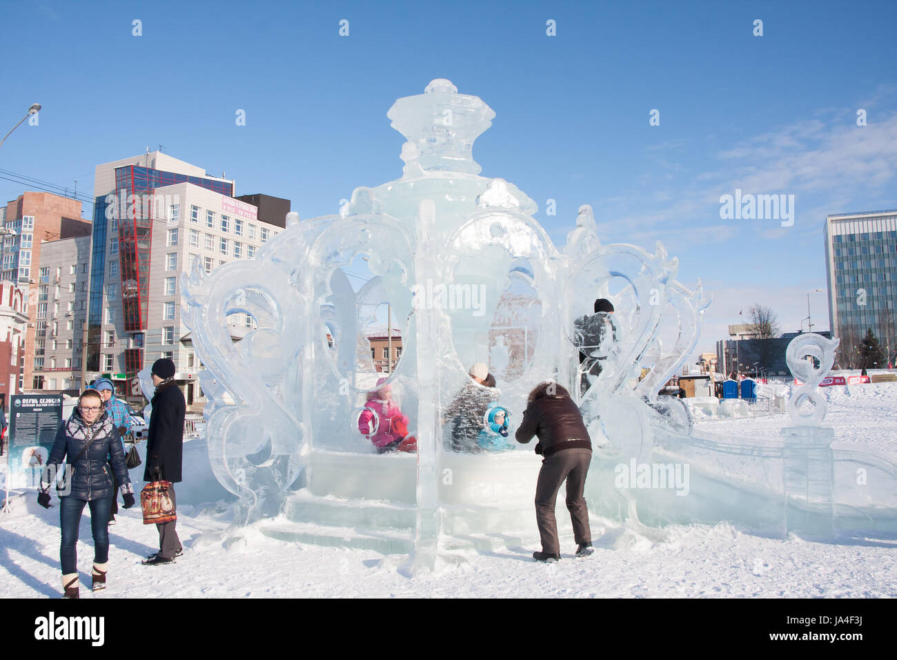 PERM, RUSSIA, Feb, 06.2016: Family is photographed in ice samovar, city ...