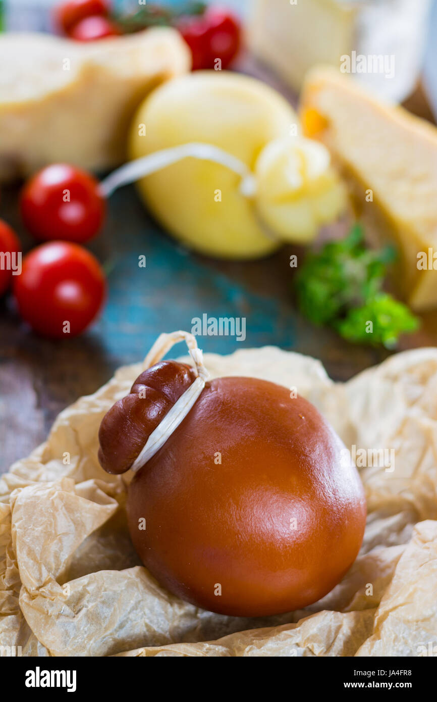 Traditional Italian hard cheese Provolone of Caciocavallo smoked and ...