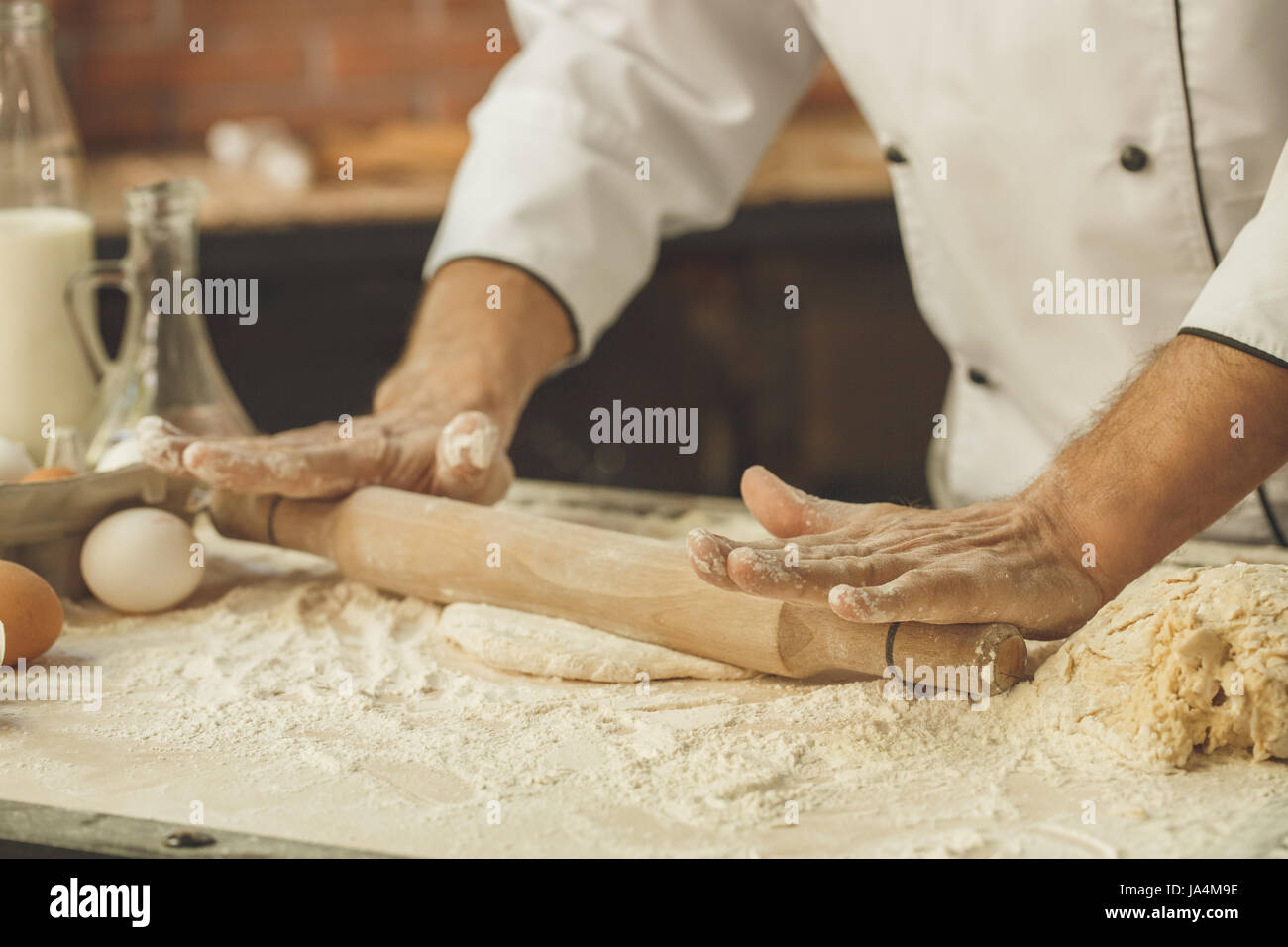 Bakery chef cooking bake in the kitchen professional Stock Photo - Alamy
