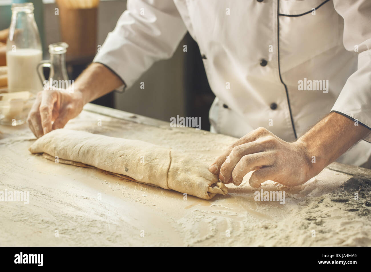 Bakery chef cooking bake in the kitchen professional Stock Photo - Alamy
