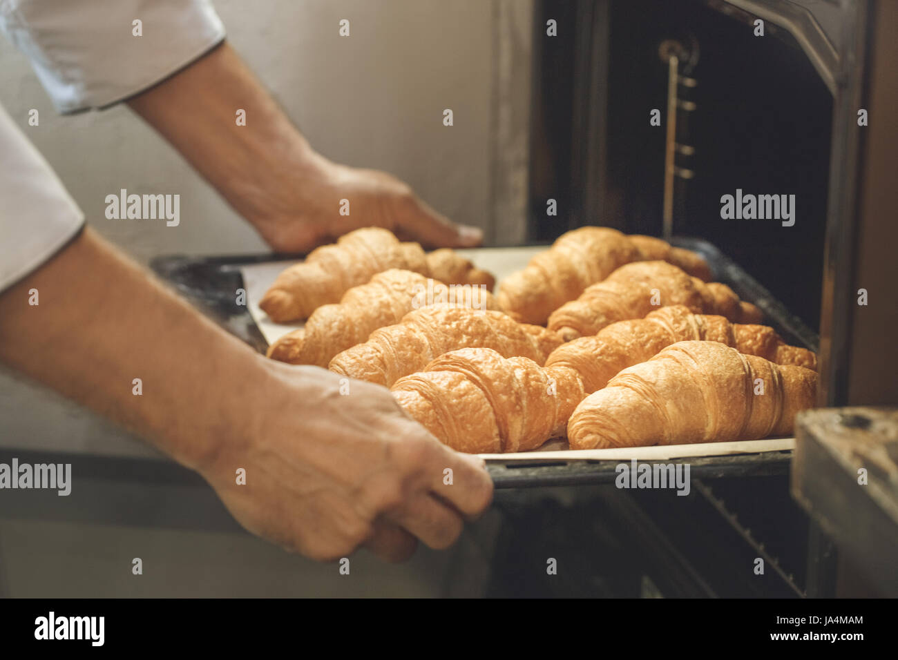 Bakery chef cooking bake in the kitchen professional Stock Photo - Alamy