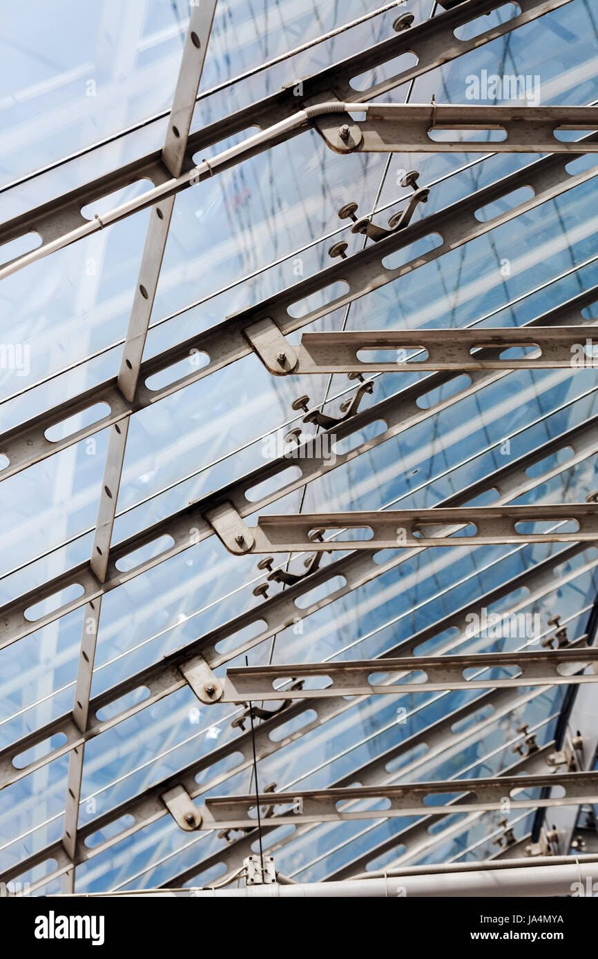 Modern metal industrial construction and a transparent glass roof ...