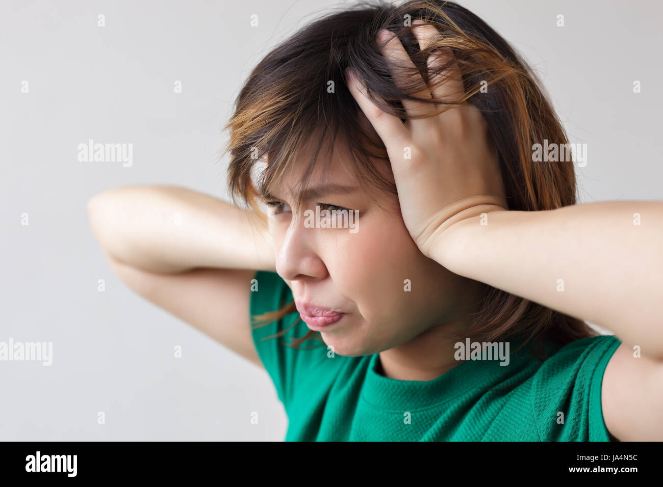 girl in grief and sadness covers her ears and eyes Stock Photo - Alamy