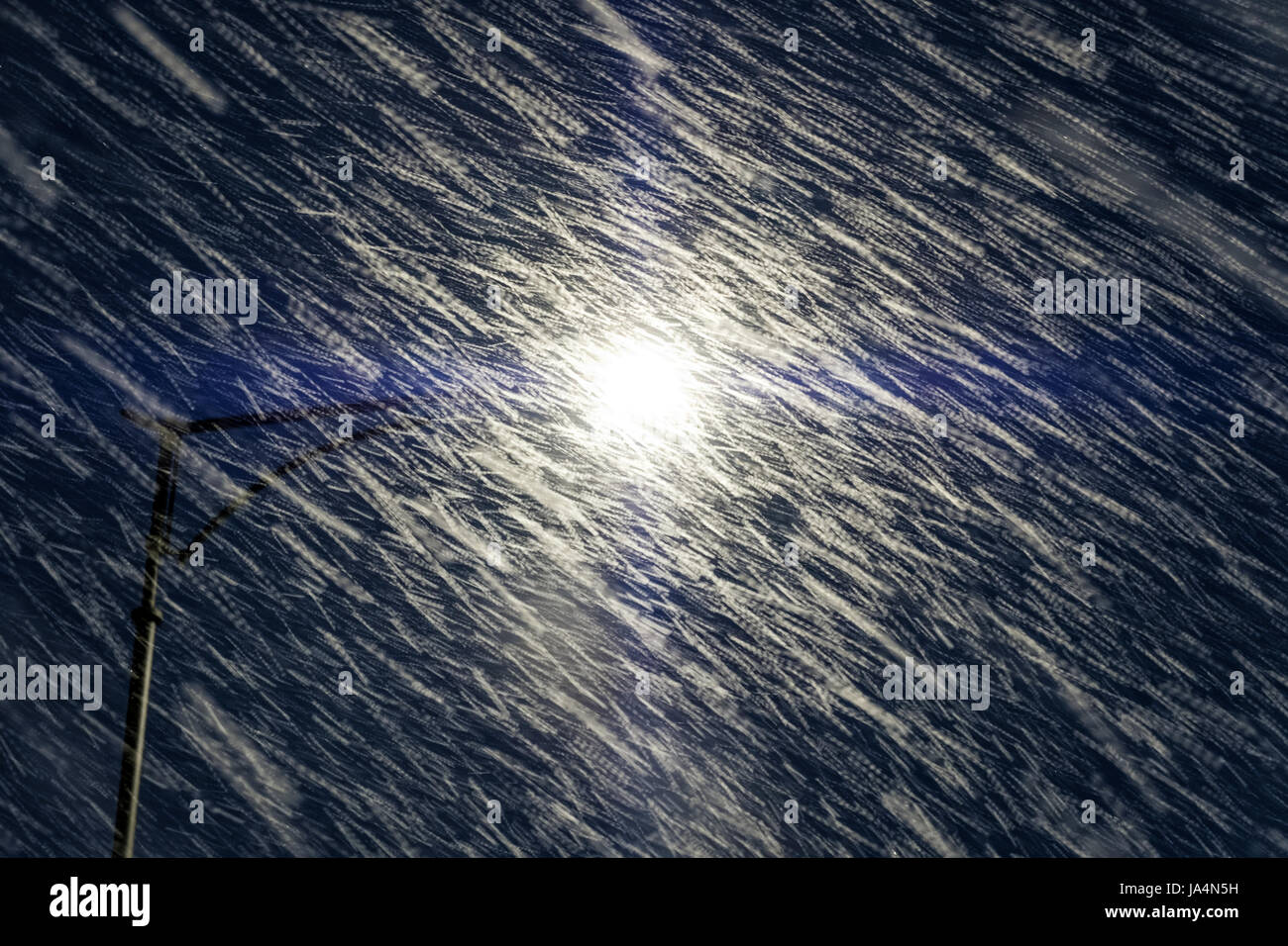 Lantern at night during a heavy snowfall. Motion blurred Stock Photo ...