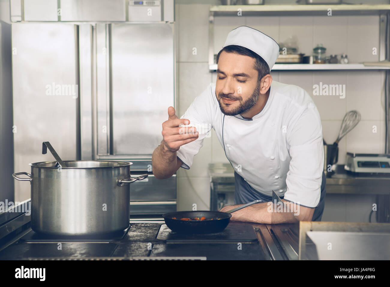 Man japanese restaurant chef cooking in the kitchen Stock Photo - Alamy