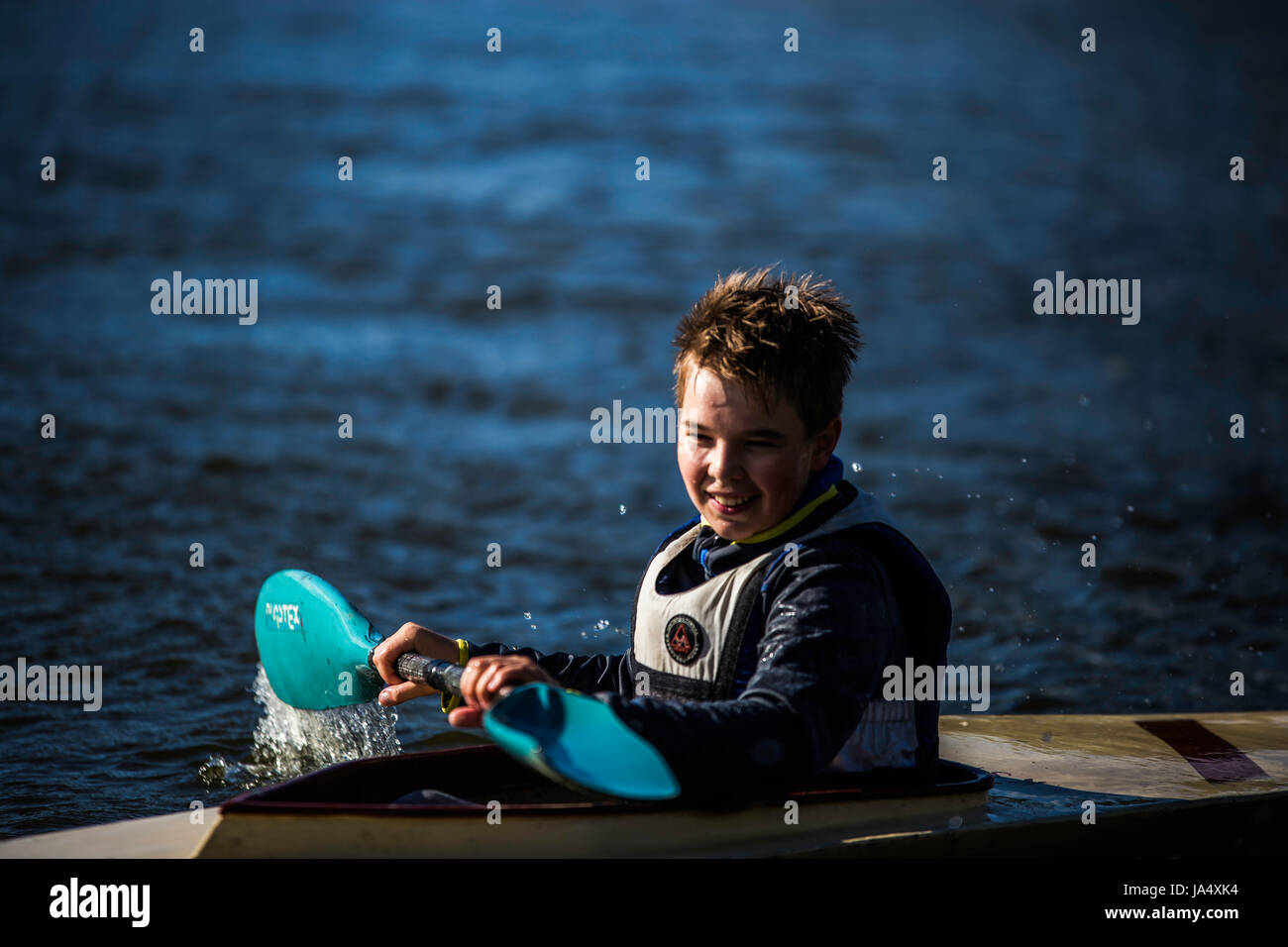 A boy in a row club in Poland. Hard work on a sport form in rowing and ...