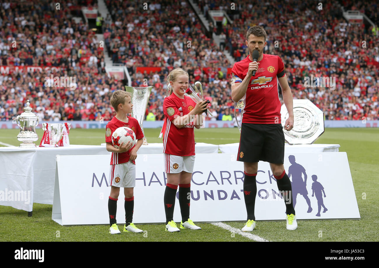Michael Carrick speaks next to his children Jacey and Louise before his ...