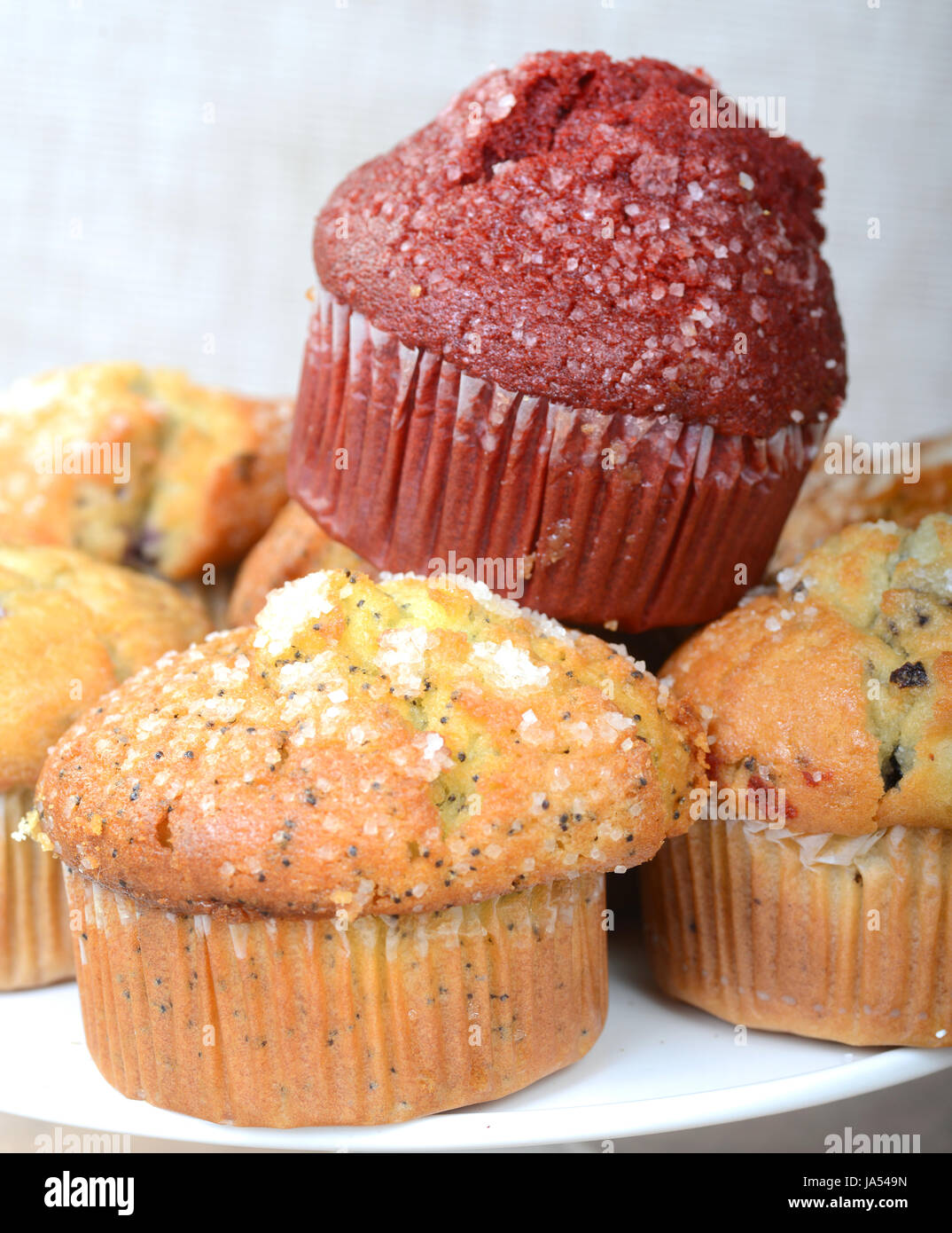 Variety of delicious breakfast muffins served on a platter Stock Photo ...