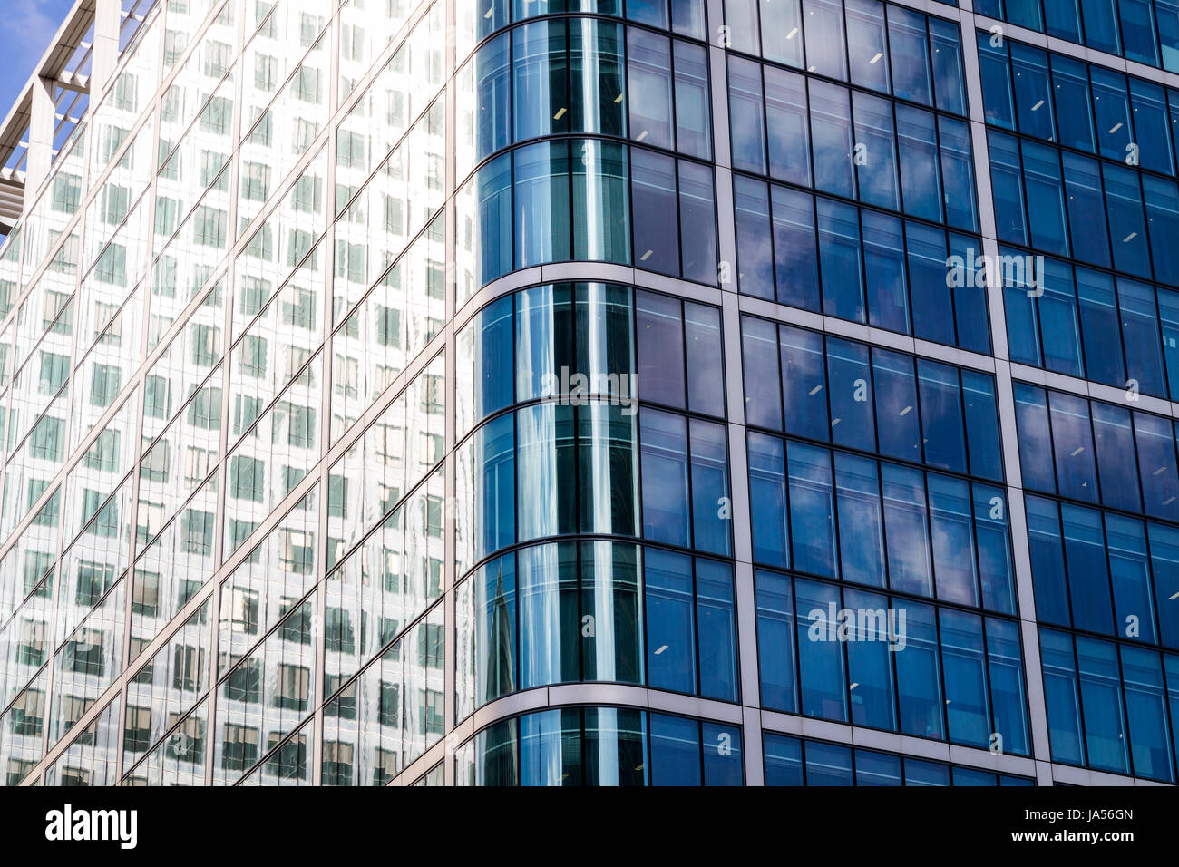 Modern glass exterior of corporate office buildings shot from a low ...
