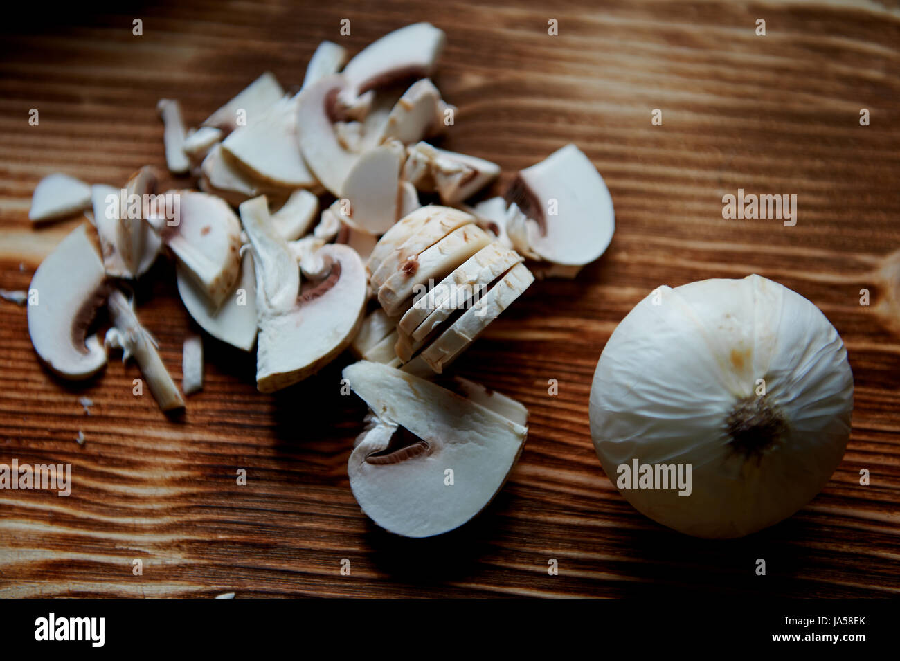 The process of cooking. mushrooms whole and sliced Stock Photo - Alamy