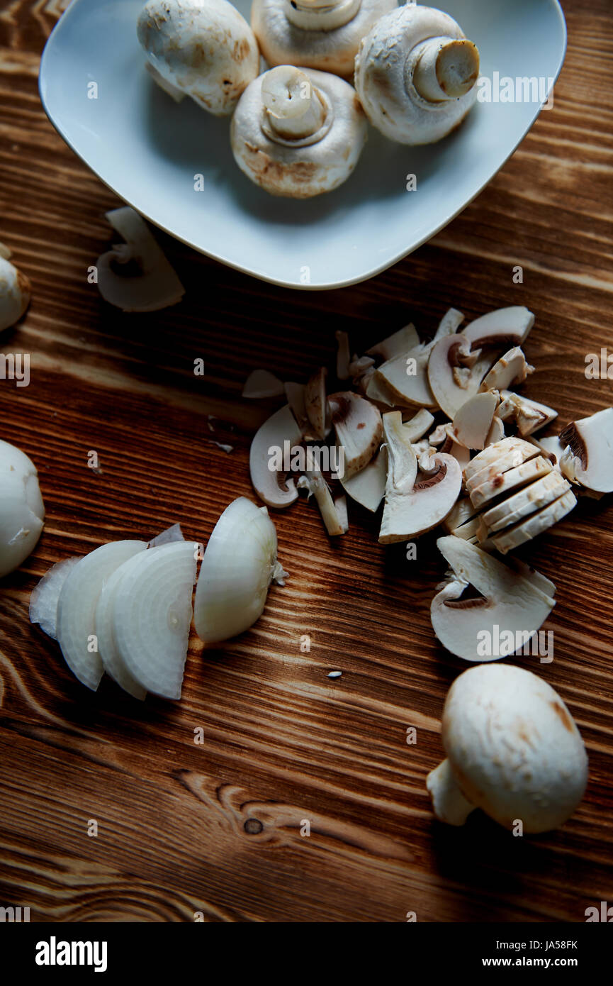 The process of cooking. mushrooms whole and sliced Stock Photo - Alamy