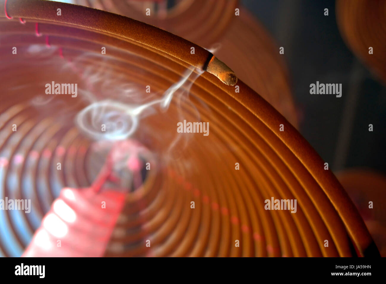 Horizontal close up of incense coils smouldering inside the Man Mo ...