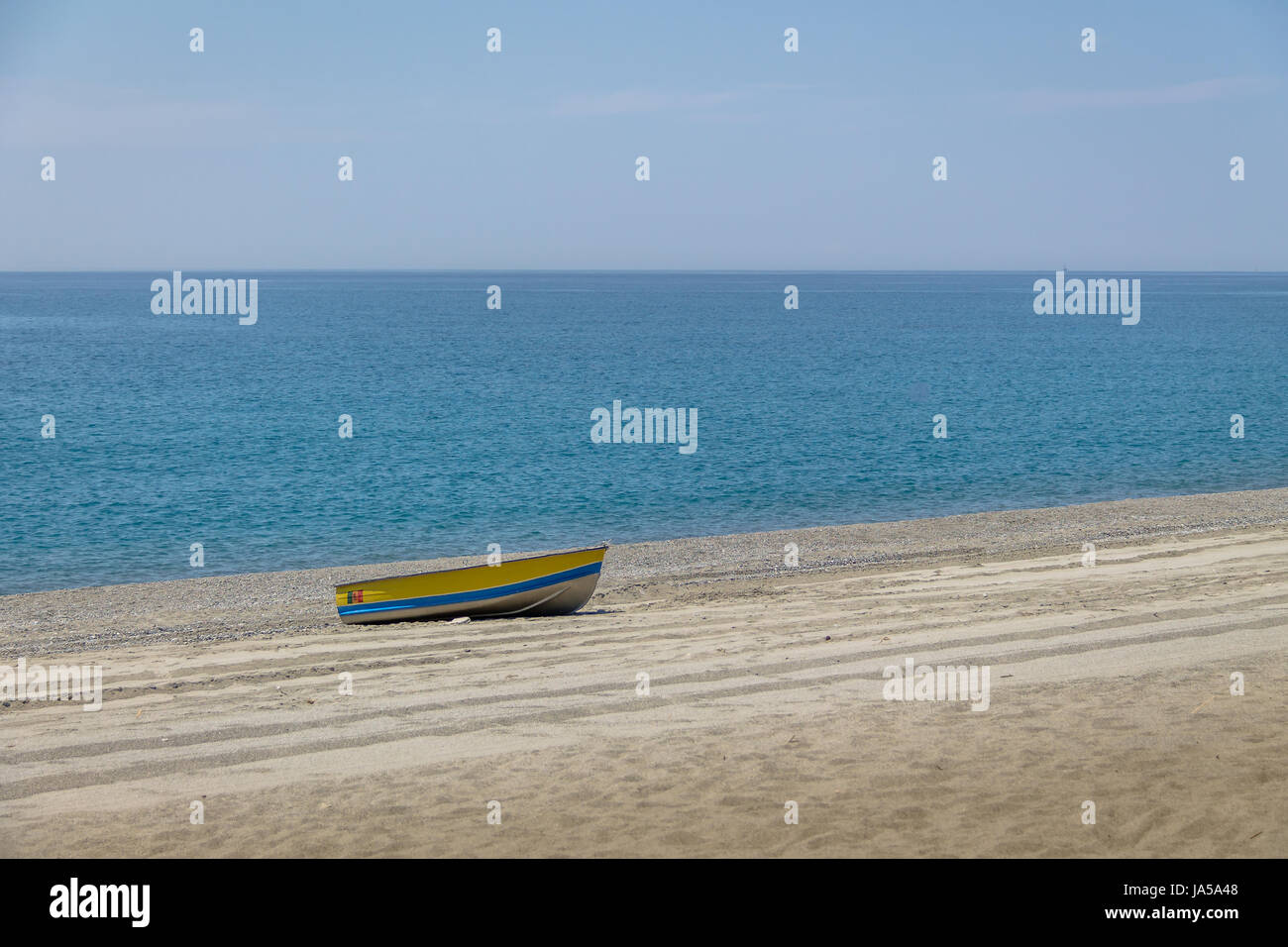 Blue and Yellow boat in a Mediterranean beach of Ionian Sea - Bova ...