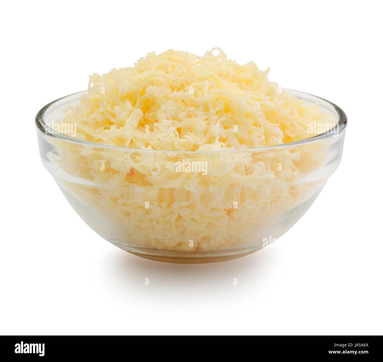 Grated cheese in a glass bowl isolated on white Stock Photo - Alamy
