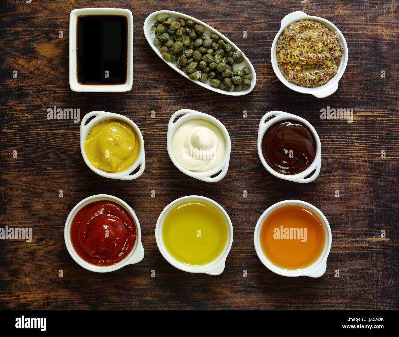 Different types of sauces and oils in bowls, top view Stock Photo - Alamy
