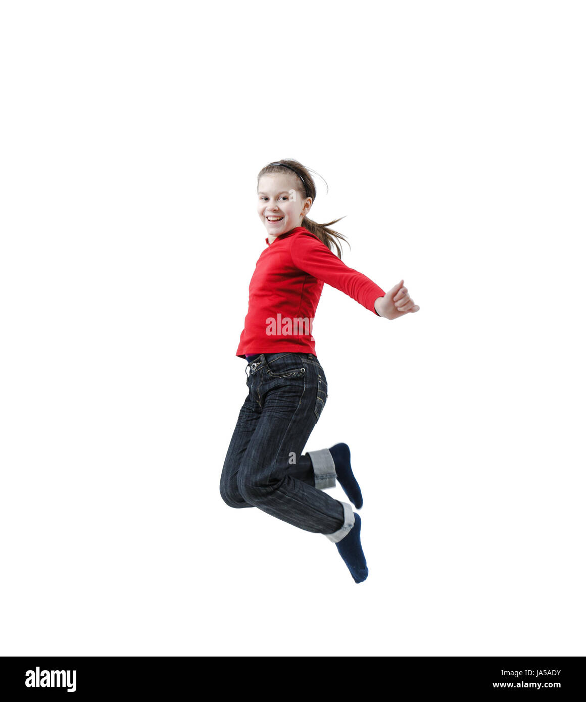 Happy baby girl jumping on a white background Stock Photo - Alamy