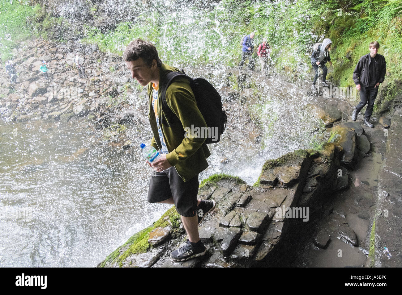 People,hiking,walk,behind,beneath,waterfall,Sgwd yr Eira,Waterfall of ...