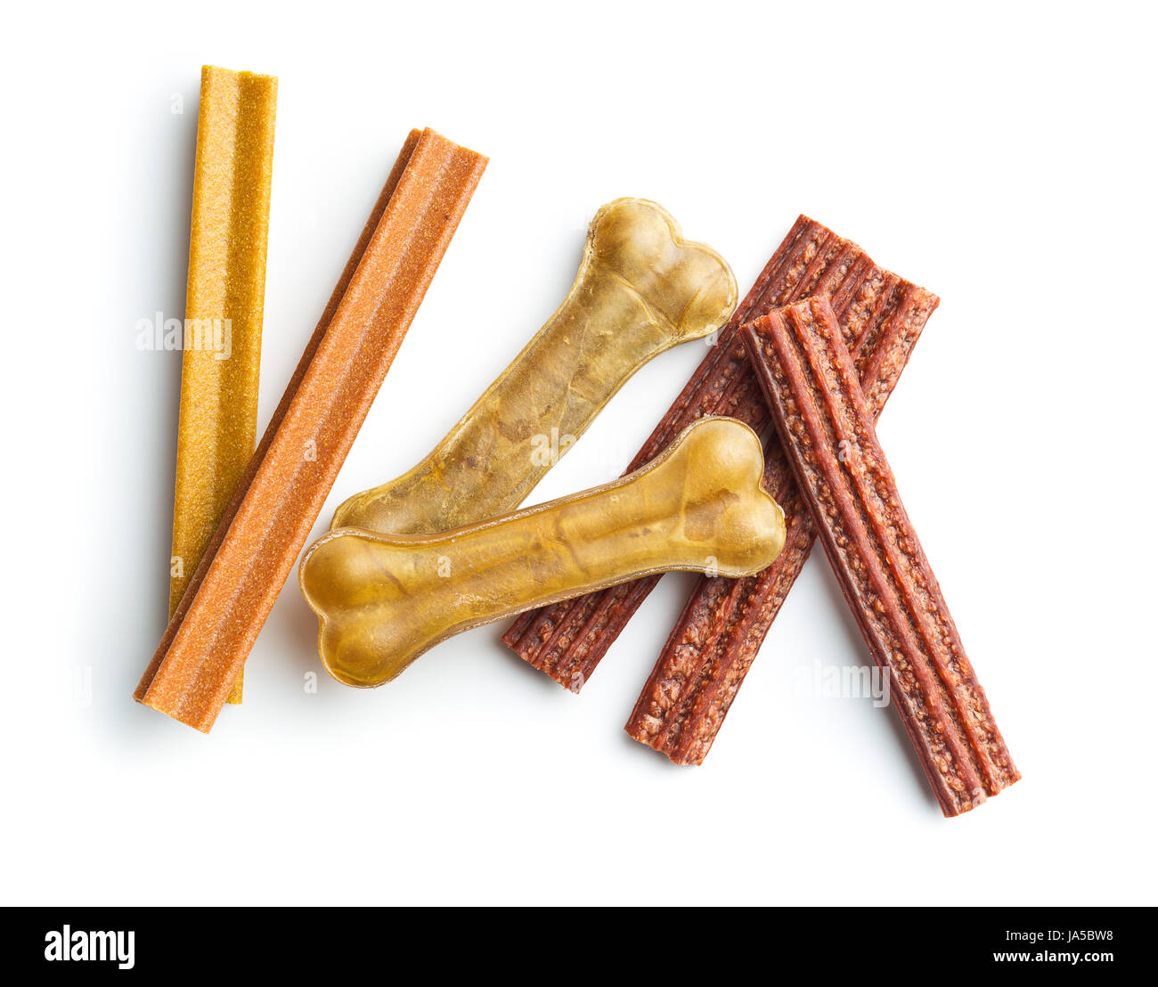 Dog chew bone and sticks isolated on white background Stock Photo - Alamy