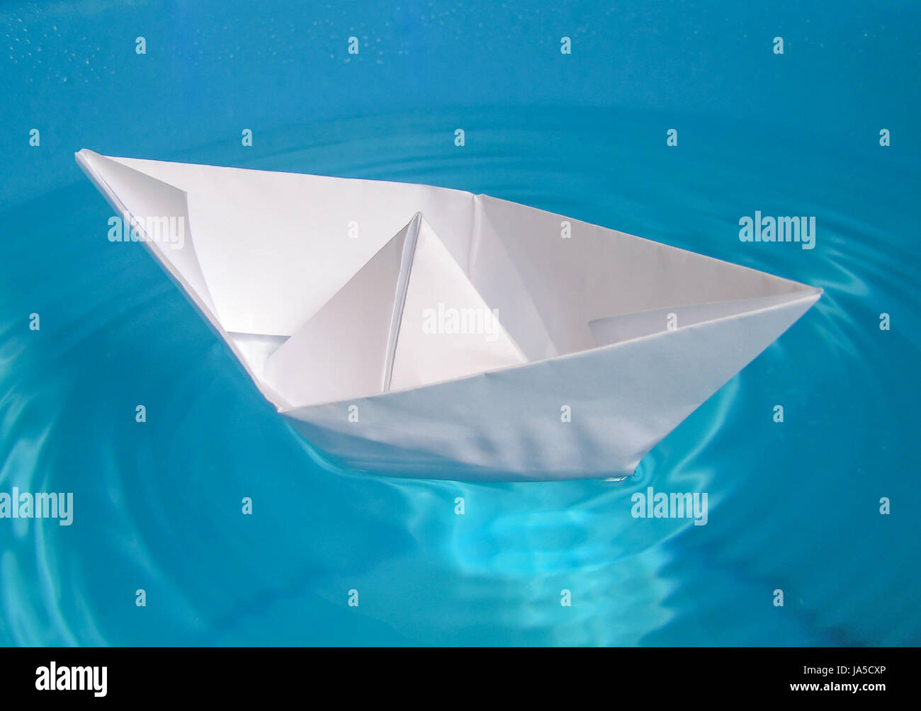 A picture of Paper ship in water Stock Photo - Alamy