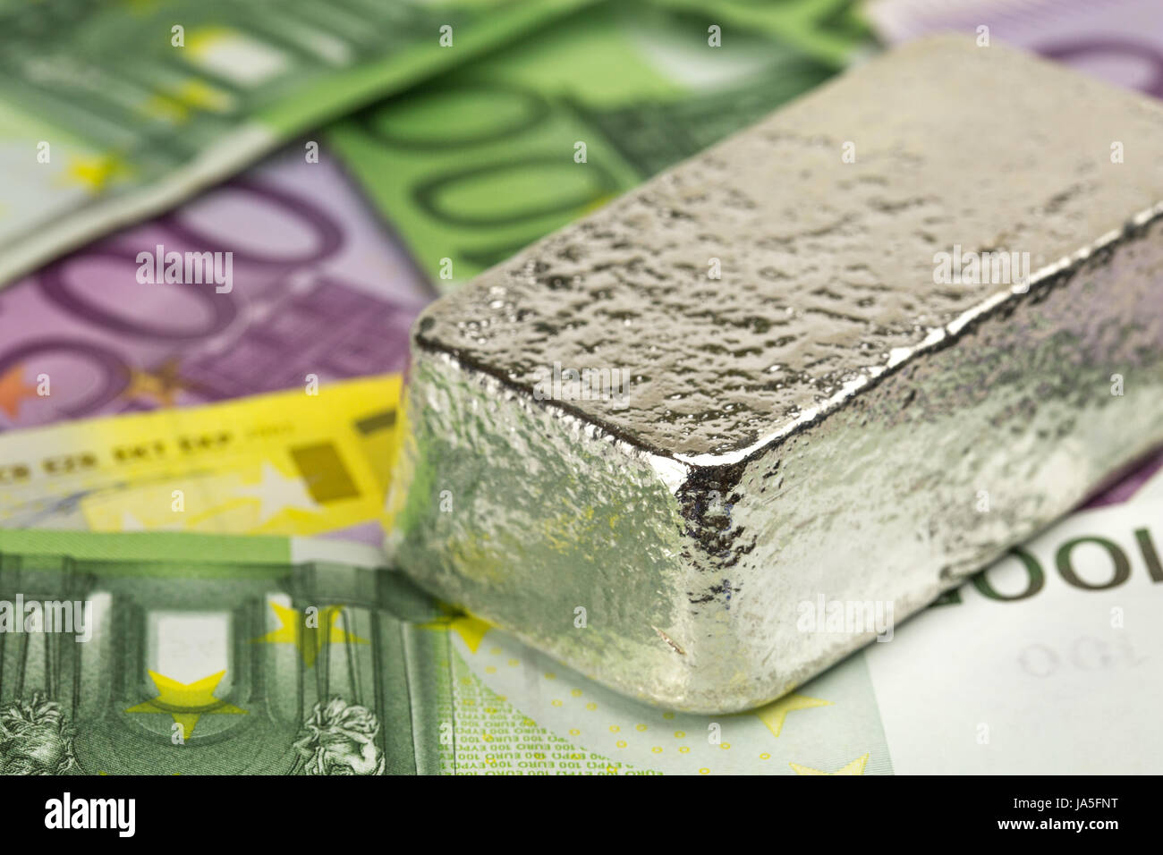 silver bars on banknotes 2 Stock Photo - Alamy