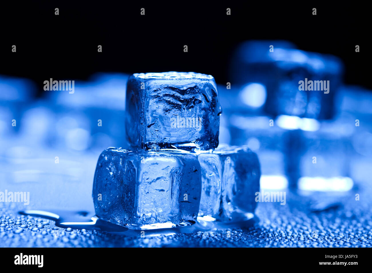 Blue and shiny ice cubes Stock Photo - Alamy