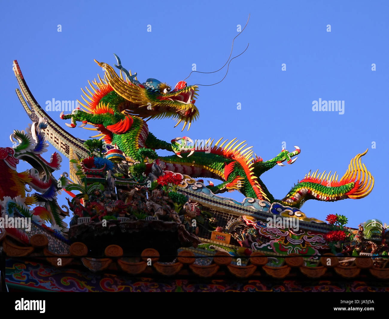 wooden sculpture of traditional chinese dragon on the temple's roof ...