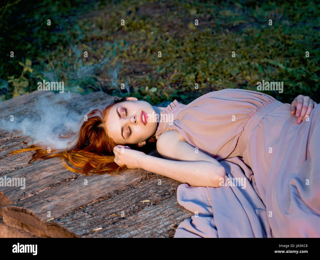 nice model lies on the bridge Stock Photo - Alamy