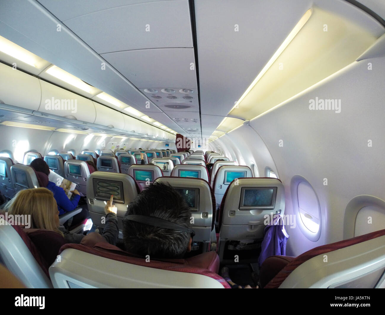 Airplane's cabin with passengers during flights Stock Photo - Alamy