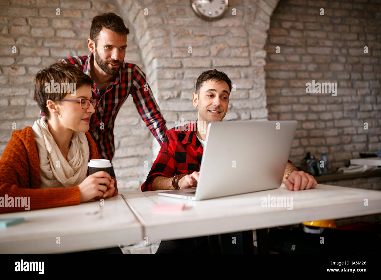 Team of creative business designers working together Stock Photo - Alamy