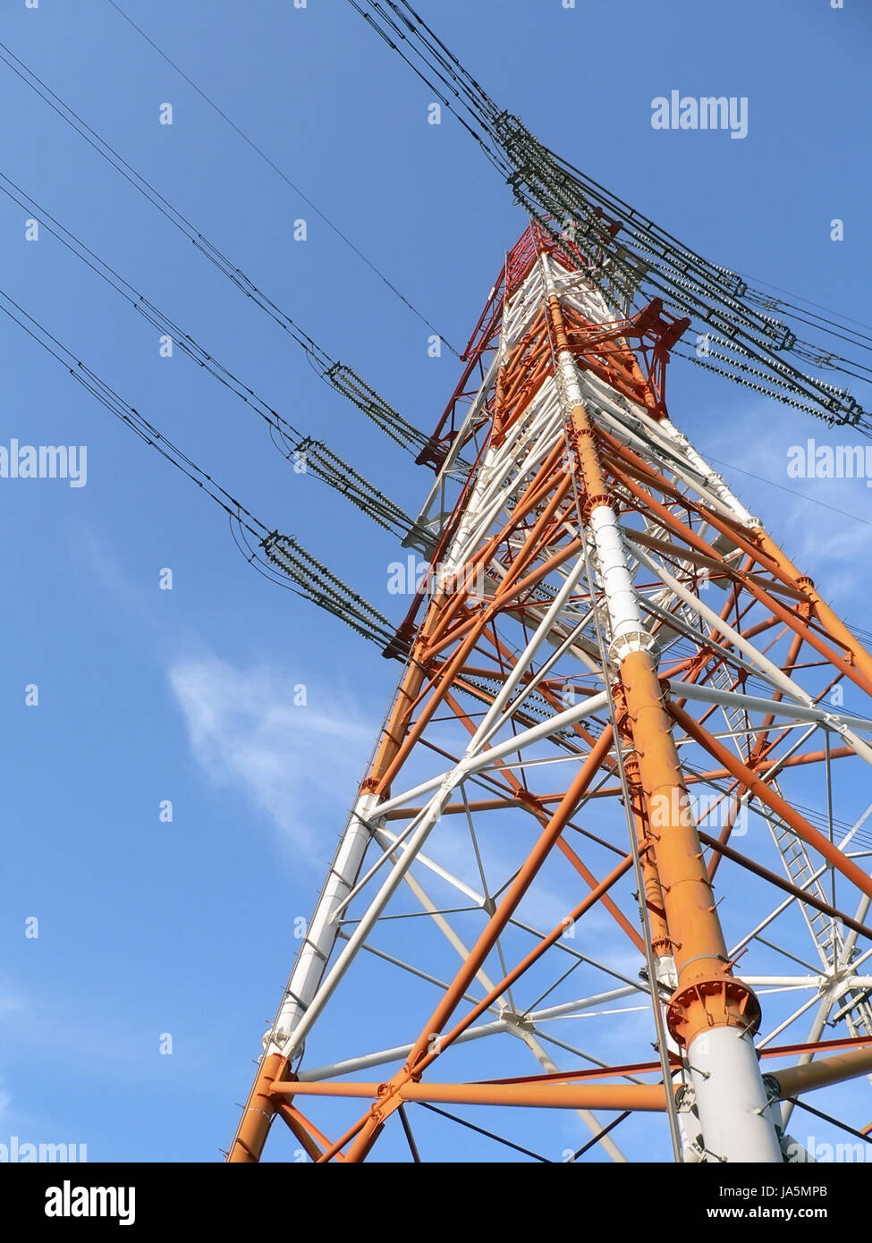 high-rise industrial electricity pylon over clear blue sky Stock Photo ...