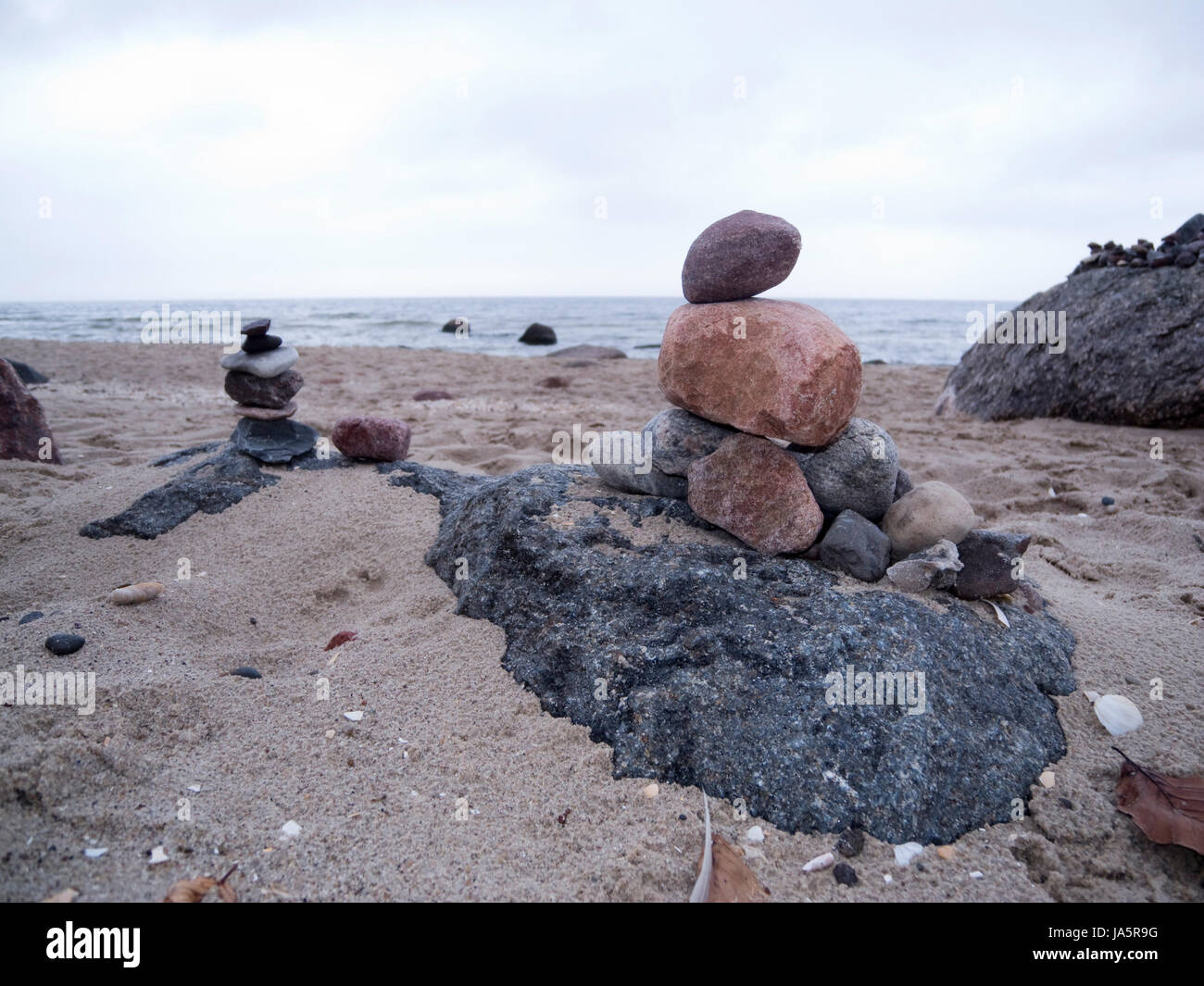 stacked stones on a beach Stock Photo - Alamy