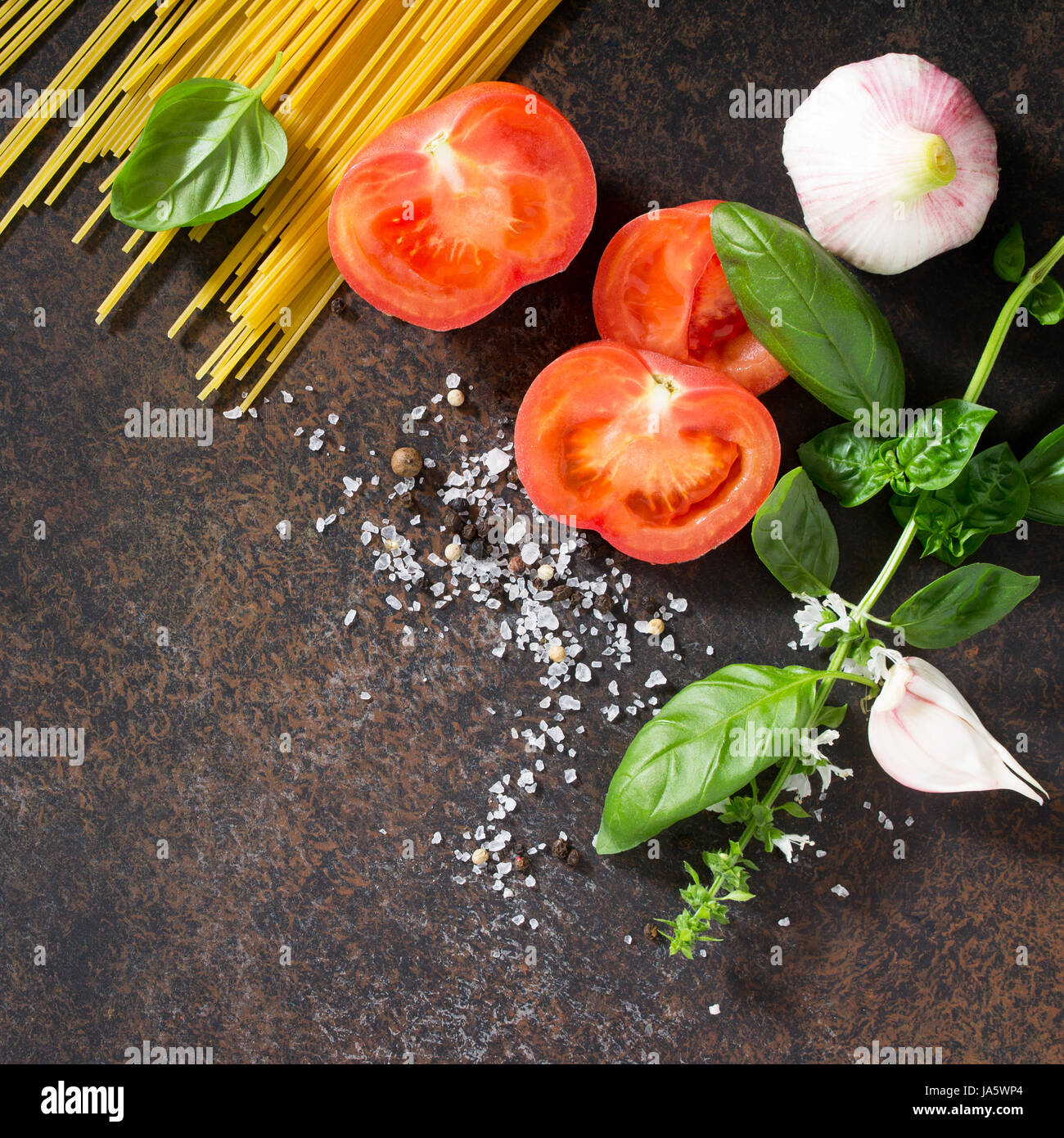Culinary background for cooking pasta, tomato sauce, fresh herbs and ...