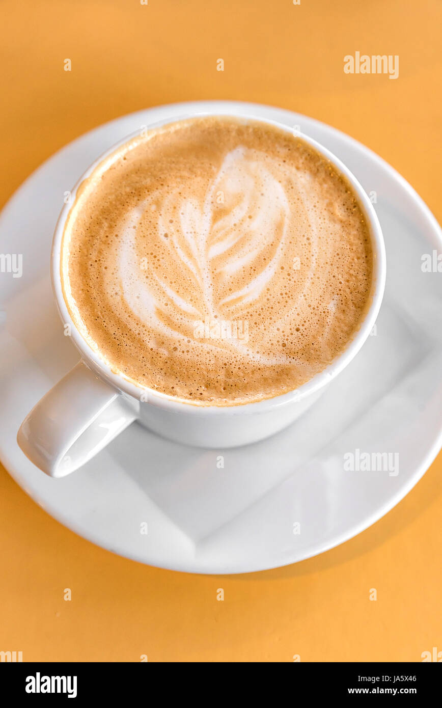 Cafe Late with lette art on coffee Stock Photo - Alamy