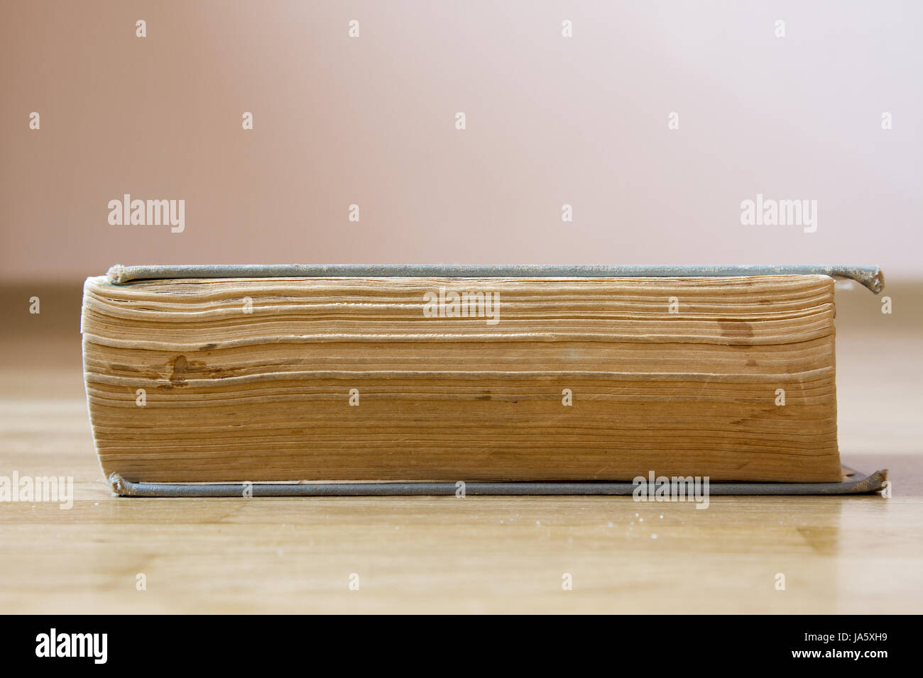 Thick old book Stock Photo - Alamy