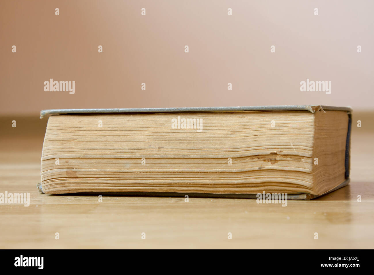 Thick old book Stock Photo - Alamy