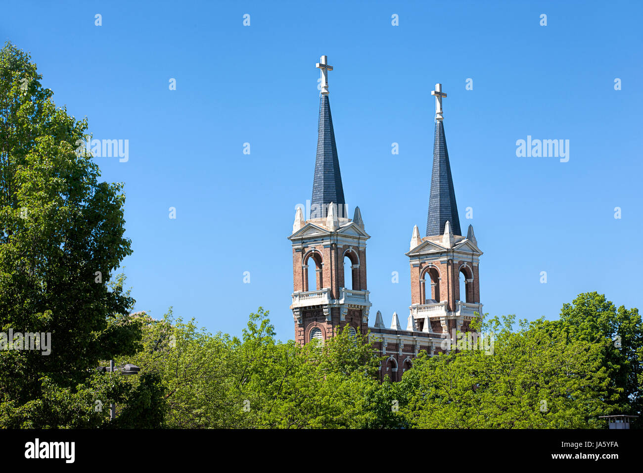 Church towers surrounded by green trees in downtown Spokane, Washington ...