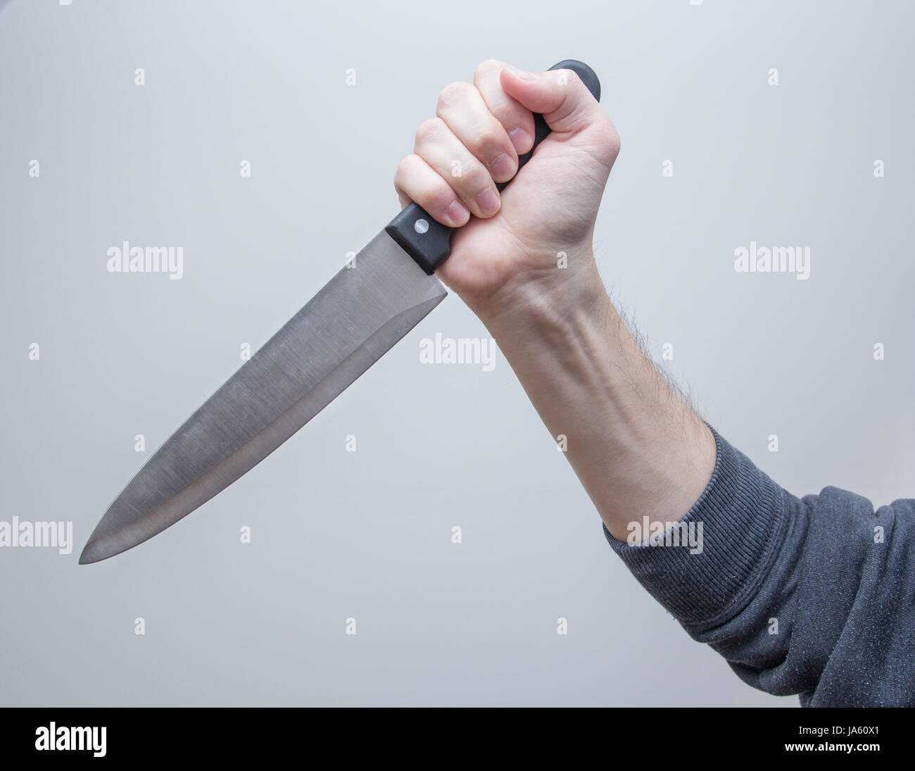 big kitchen knife in man hand Stock Photo - Alamy