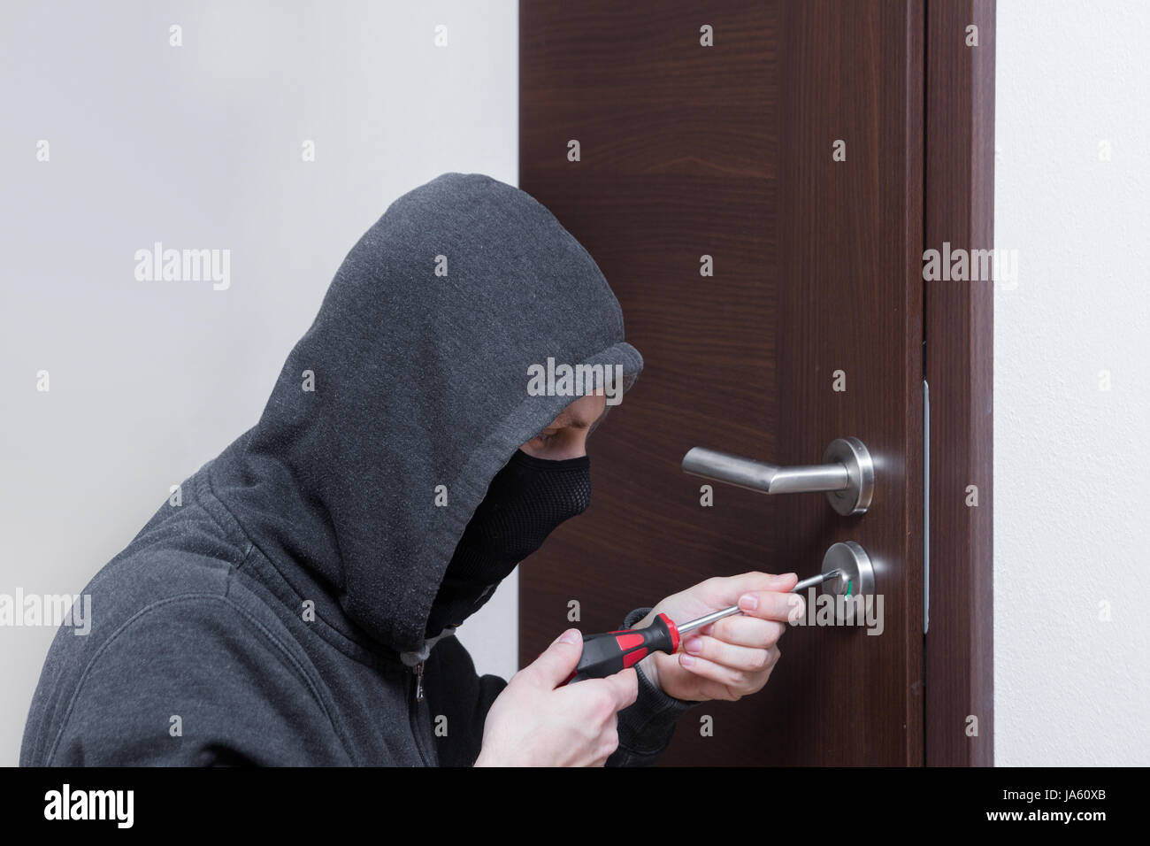 thief opening lock Stock Photo - Alamy