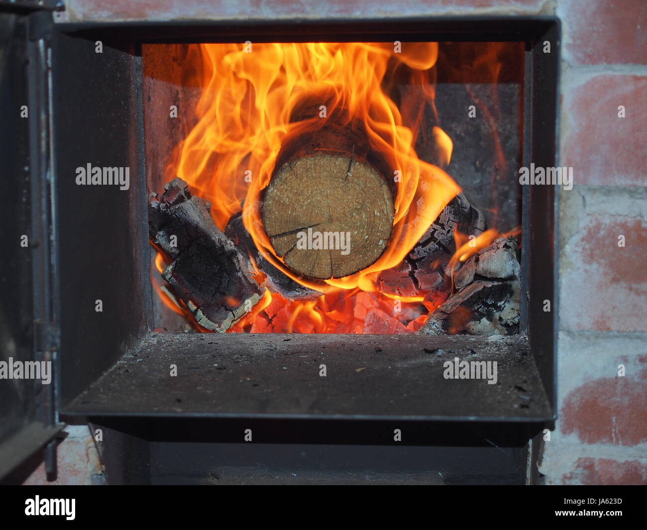 The flames in the firebox. Burning firewood. The firebox of the furnace ...