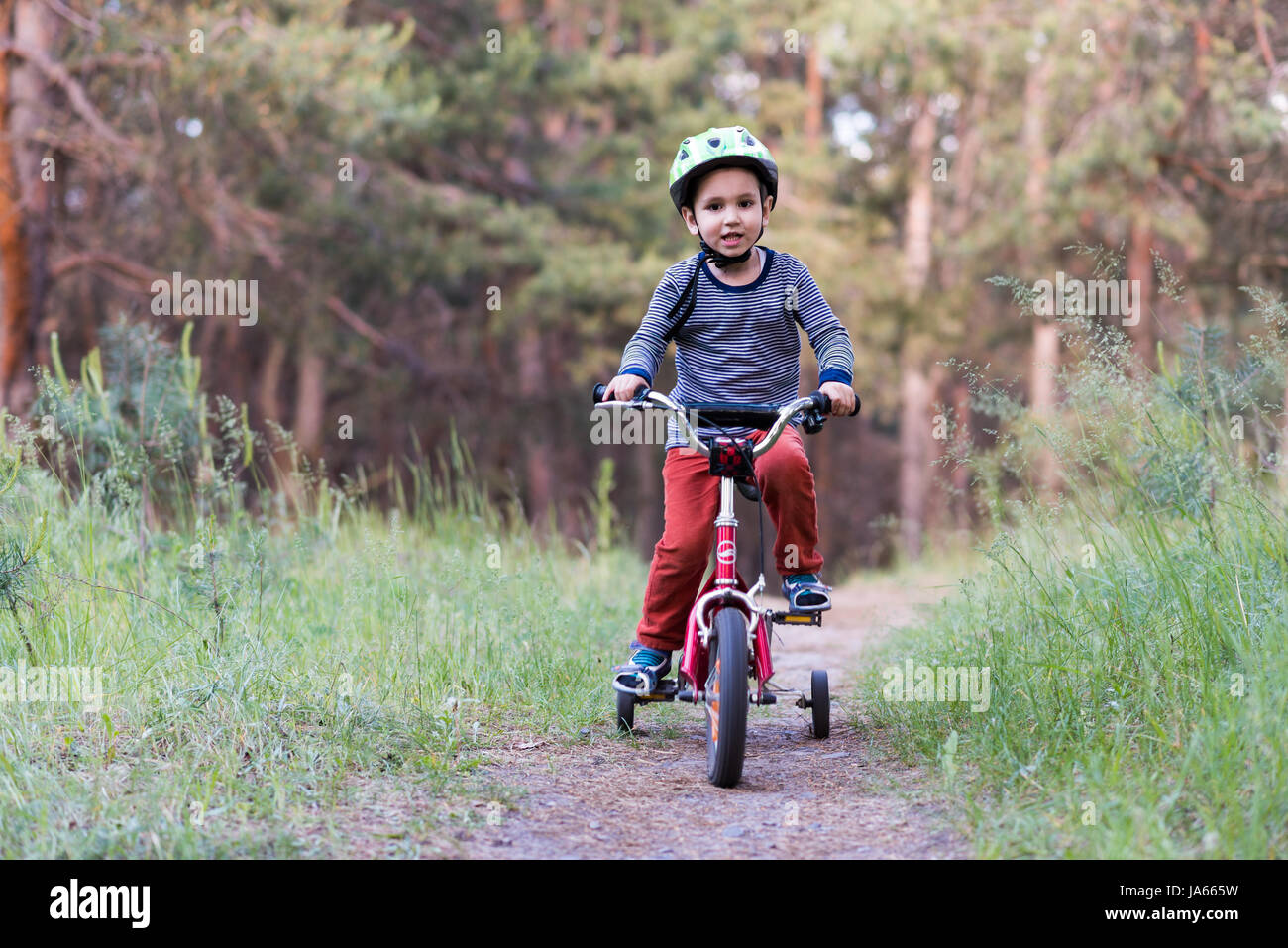 Child riding a bicycle Stock Photo - Alamy