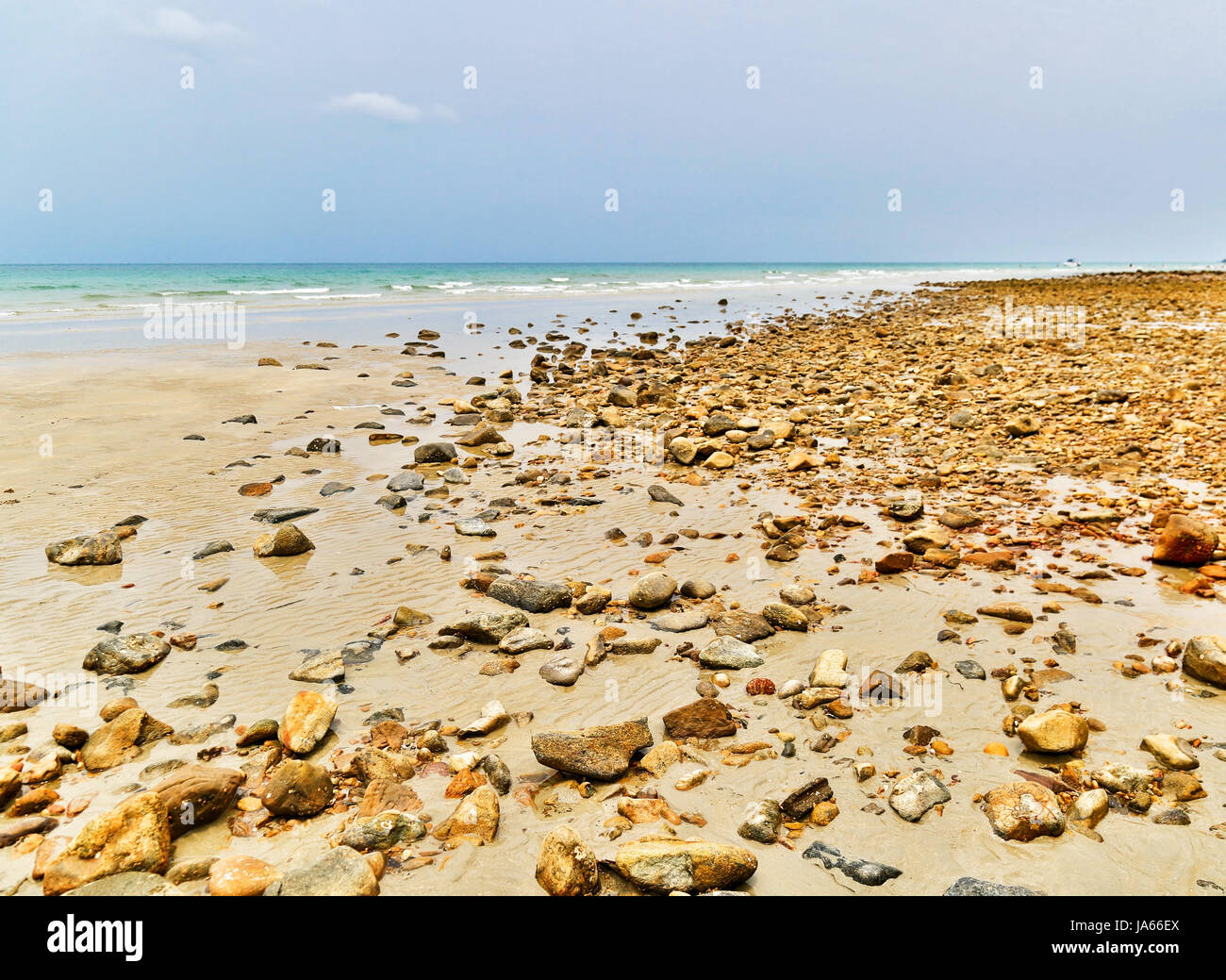 Beautiful tropical beach with stones. Nature background Stock Photo - Alamy