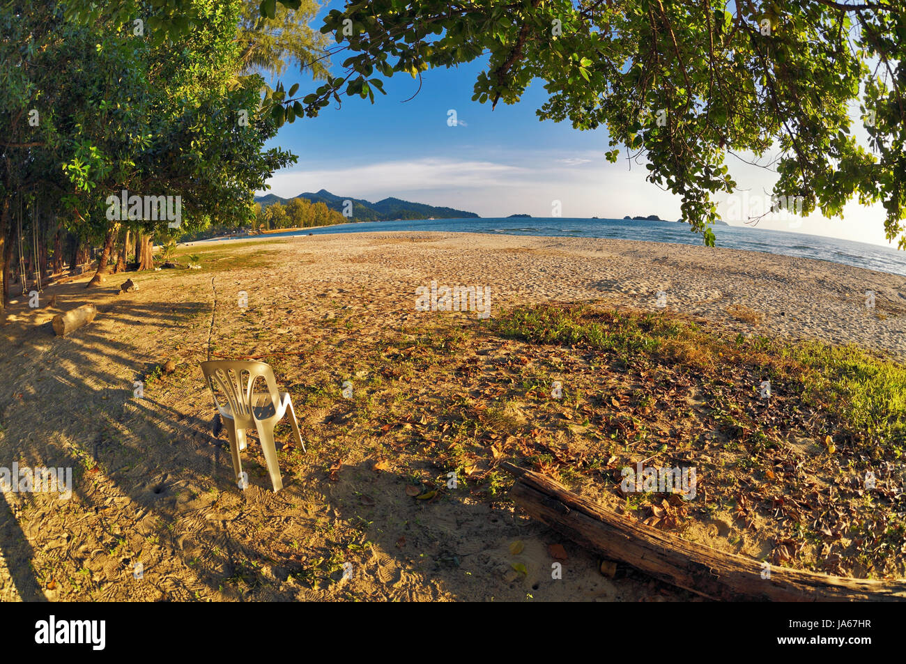 fisheye view on beach and tropical sea under blue sky Stock Photo - Alamy