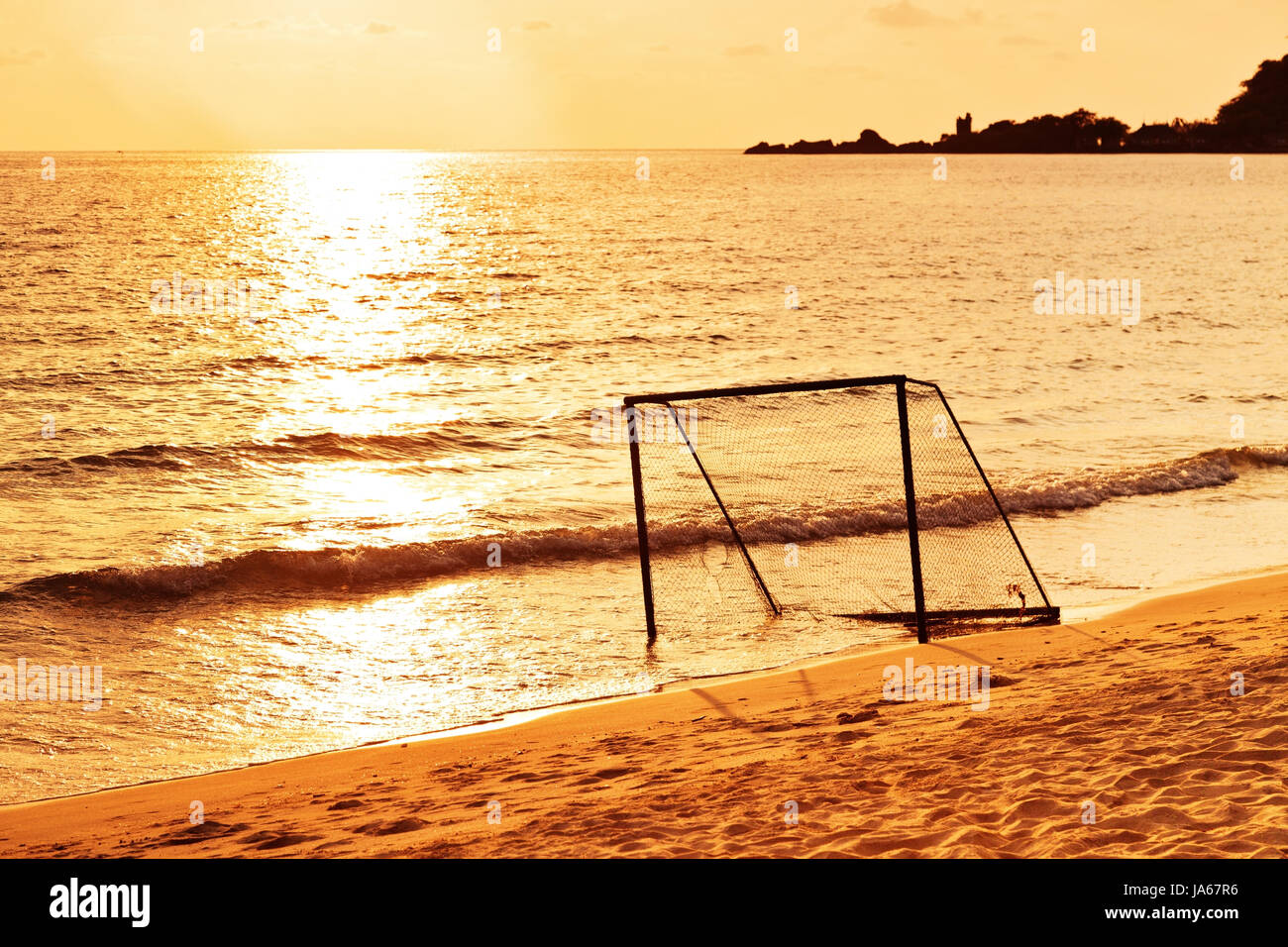 Football goal on a beach at sunset time Stock Photo - Alamy