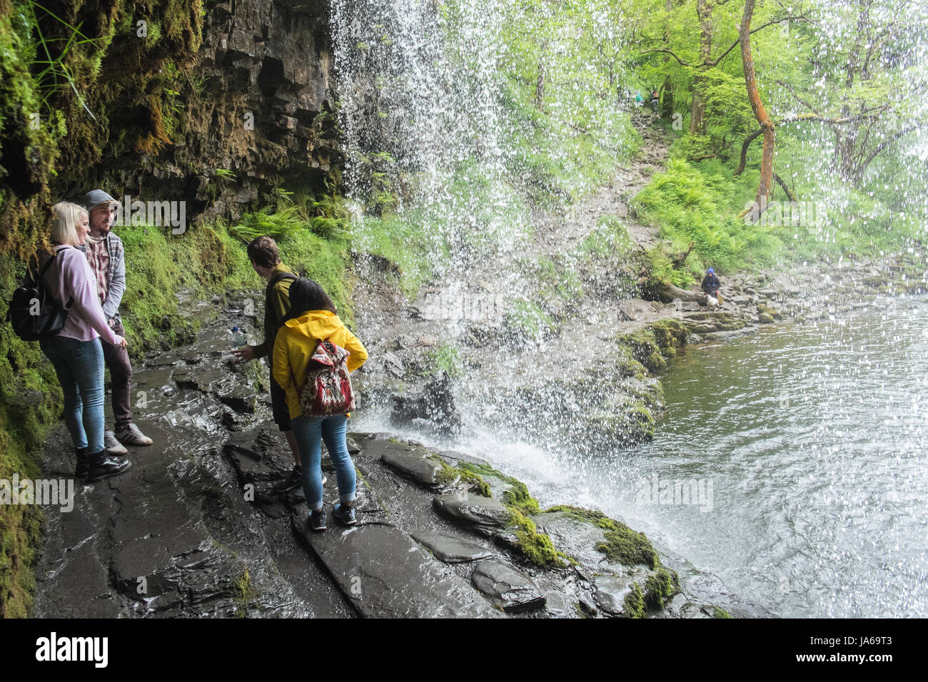 People,hiking,walk,behind,beneath,waterfall,Sgwd yr Eira,Waterfall of ...