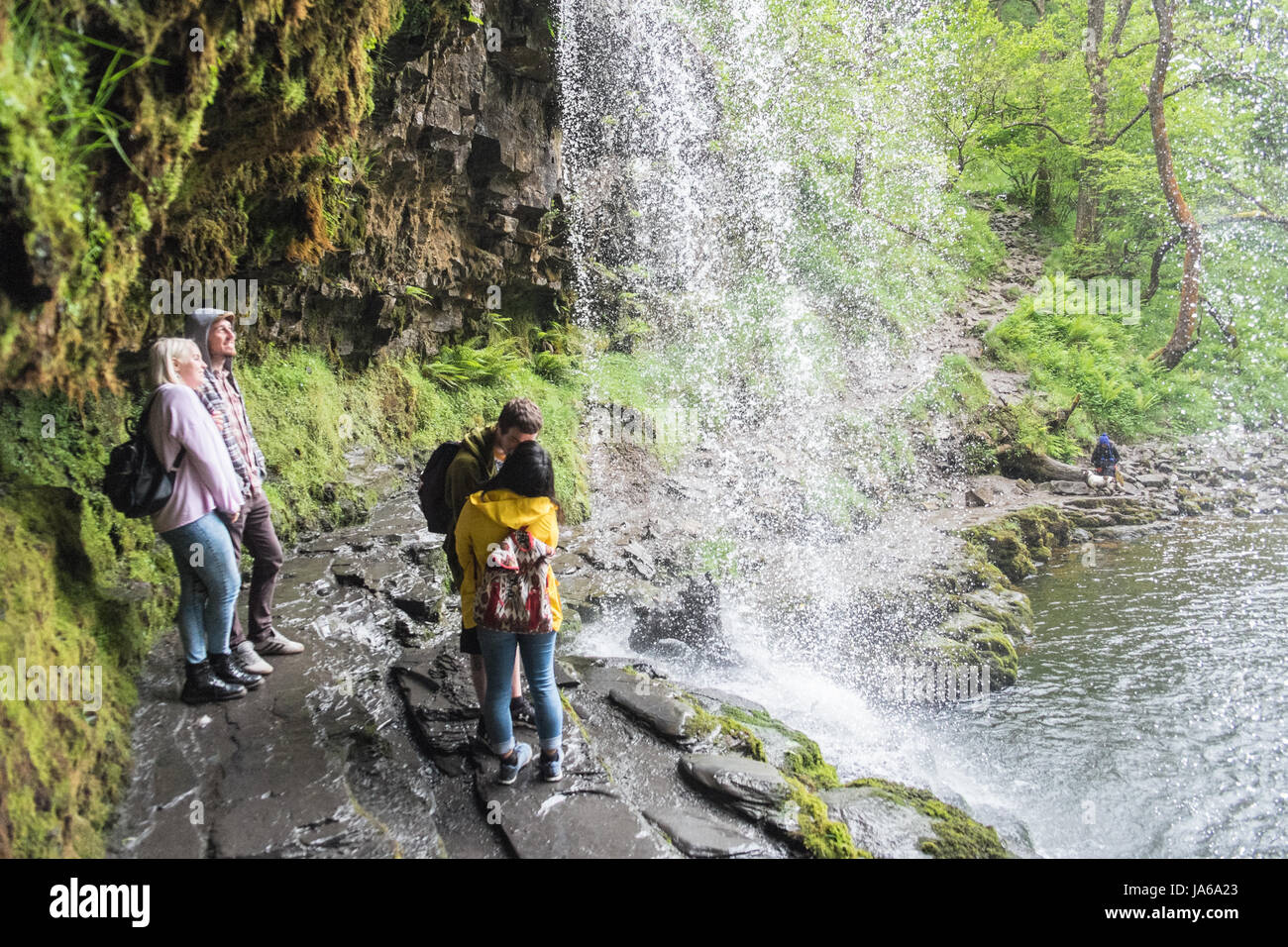 People,hiking,walk,behind,beneath,waterfall,Sgwd yr Eira,Waterfall of ...