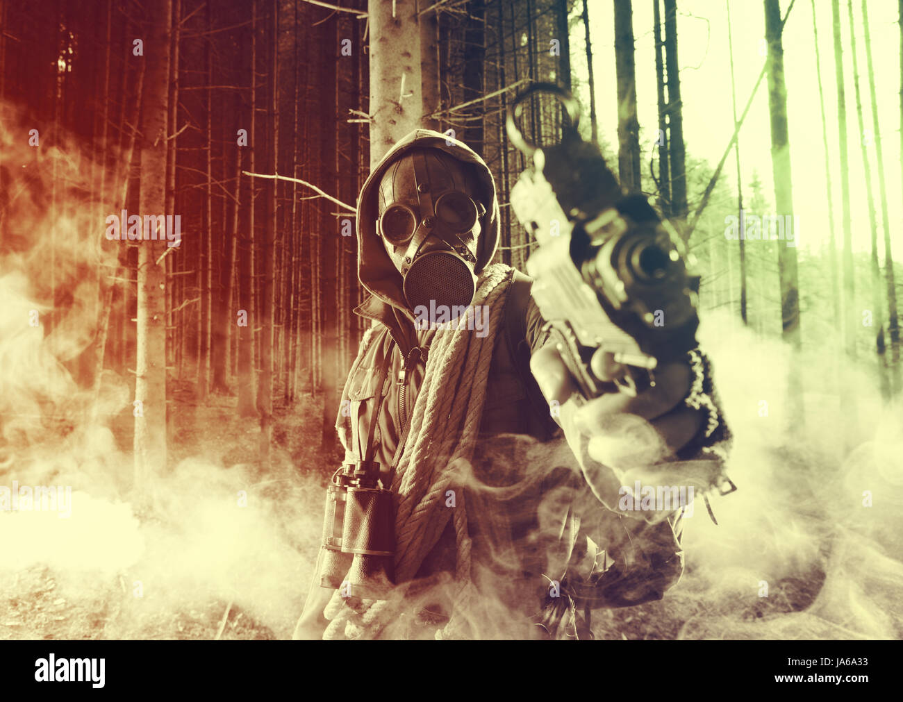 Soldier wearing a gas mask pointing a gun Stock Photo - Alamy
