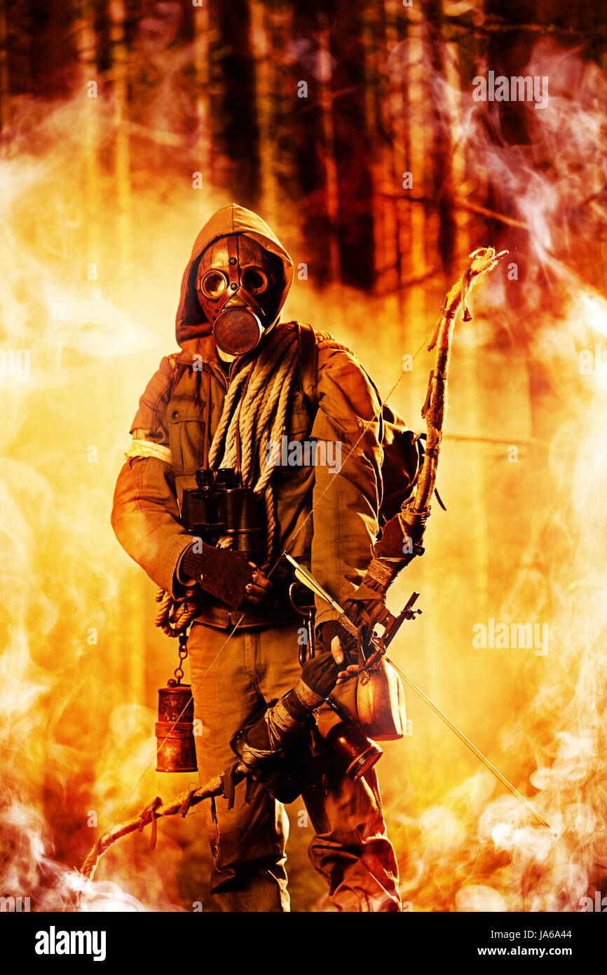 Soldier with a bow in a forest on fire Stock Photo - Alamy